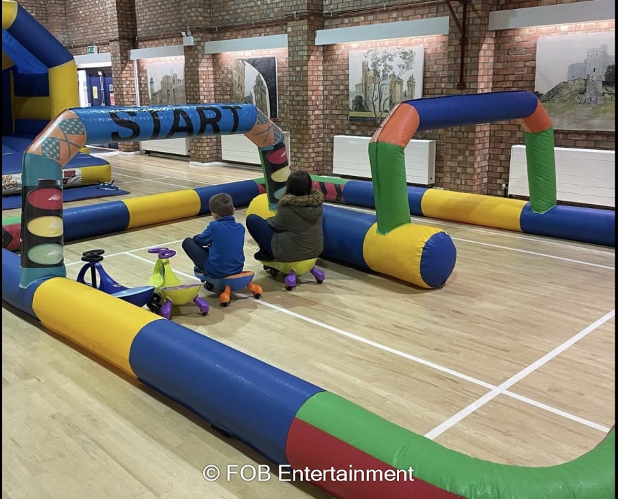 Swing Cars Race Track: The Ultimate Inflatable Fun! Call our team Now!